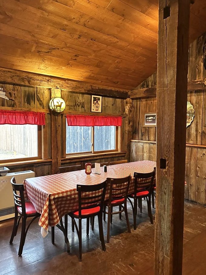 Rustic wooden beams and red-checkered tablecloths create the quintessential New England dining atmosphere that no designer could replicate.