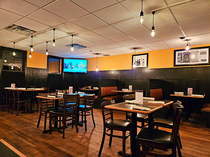 Inside, Edison bulbs cast a warm glow over wood-paneled walls, creating that perfect "I could stay here all afternoon" vibe.