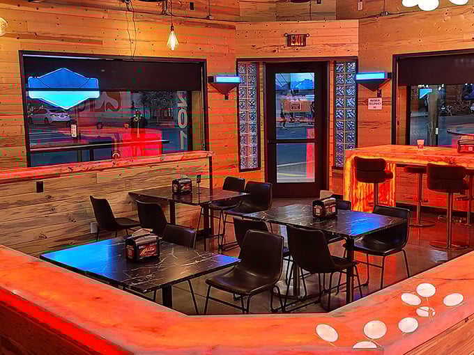 Warm wood paneling bathed in devilish red light – the perfect ambiance for contemplating just how much spice you can actually handle.