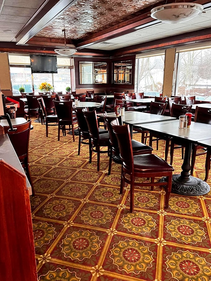 Step inside and feast your eyes on the vintage charm – ornate tin ceiling, rich wood paneling, and patterned floors that whisper "stay awhile." Classic Connecticut diner ambiance at its finest.