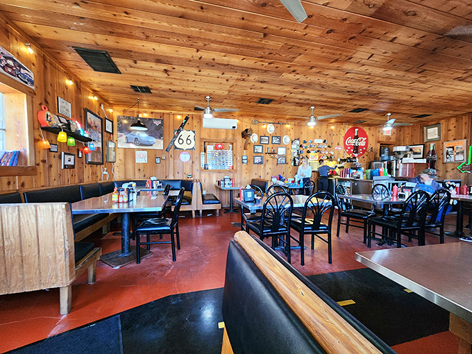 Step inside to a wood-paneled time capsule where Route 66 memorabilia covers nearly every inch, and conversations flow as freely as the coffee.