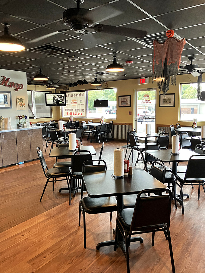 No-frills dining at its finest—black chairs, wooden floors, and ceiling fans that have witnessed countless "first bite" moments of pure joy.