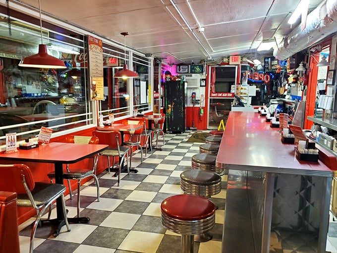 Classic black-and-white checkered floors meet cherry-red booths in this time capsule of American dining. The counter stools have witnessed decades of satisfied sighs.