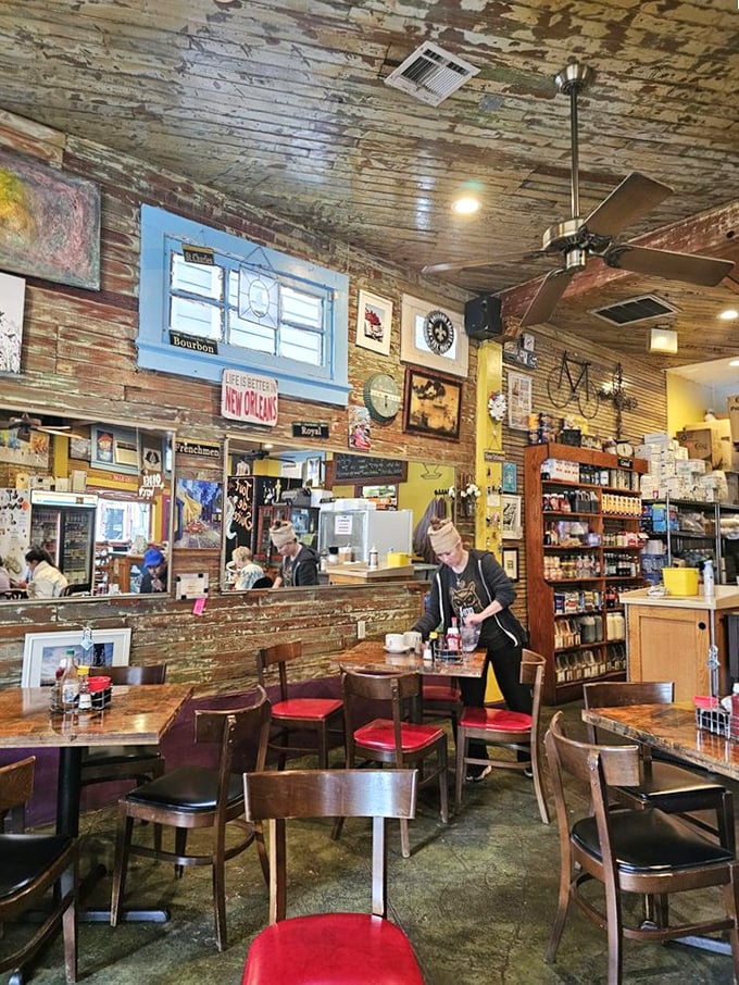 Weathered wood walls tell stories while mismatched chairs invite lingering conversations. This isn't Instagram-designed decor—it's authenticity you can feel.
