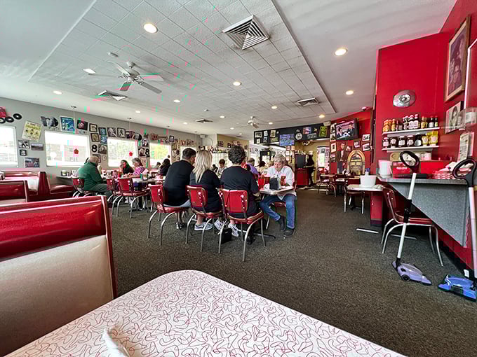 Classic red booths and memorabilia-covered walls create that time-machine feeling only authentic American diners can deliver.