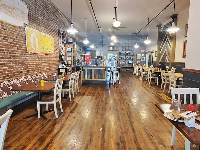 Exposed brick walls, gleaming wood floors, and pendant lighting create the perfect backdrop for burger bliss. Rustic charm meets modern comfort.