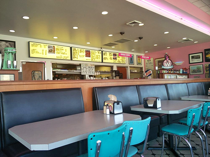 Step inside and you're transported to a simpler time—turquoise chairs, vinyl booths, and a menu board that doesn't need a decoder ring to understand.