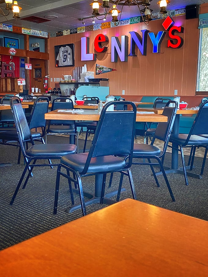 License plates and sports memorabilia create the perfect backdrop for breakfast magic. This isn't décor—it's a visual history of American road trips.