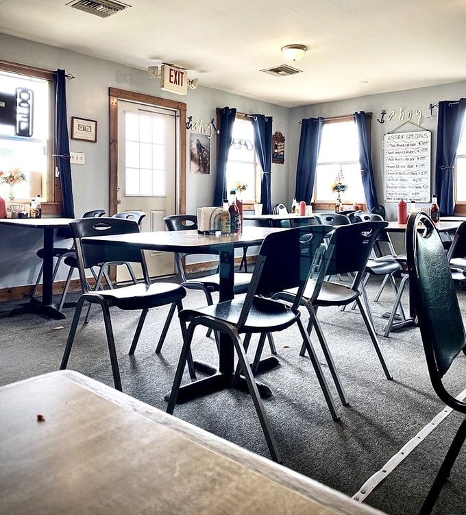 No-frills nautical charm with navy curtains and simple tables—exactly the kind of place where the food, not the decor, does all the talking.