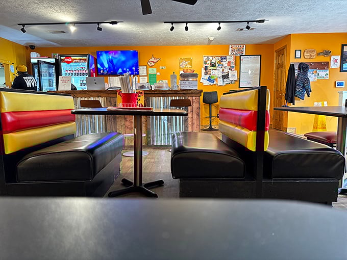 Yellow walls and red booths create that perfect diner atmosphere where comfort food and comfort conversations happen in equal measure.