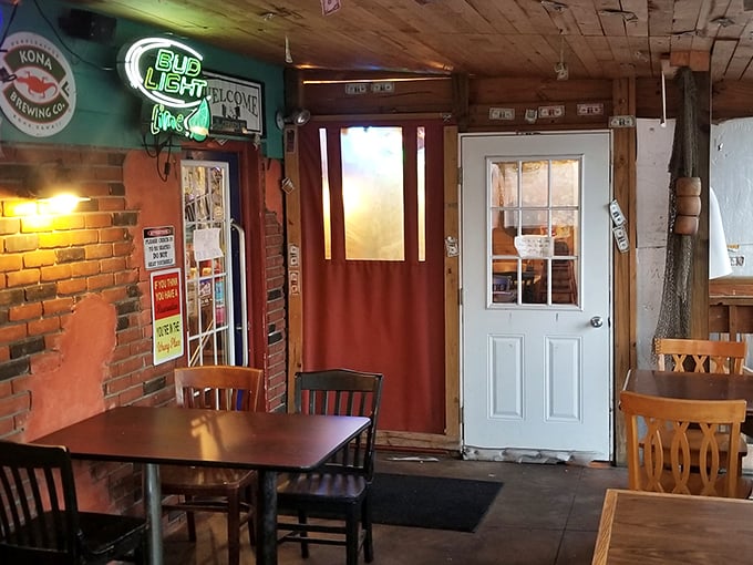 Exposed brick walls, wooden beams, and that glowing "Pub Light" sign—this is where comfort meets culinary magic in North Canton.