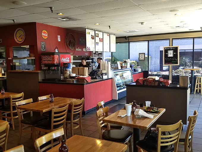 Step inside where red walls and wooden tables create the perfect backdrop for carnivorous adventures.