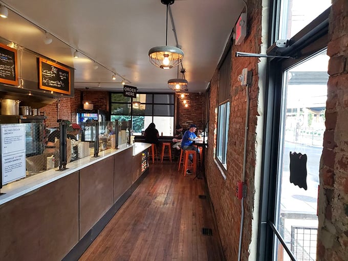 Exposed brick walls and warm wooden floors create the perfect backdrop for chicken nirvana. Simplicity with purpose—this place knows what matters.