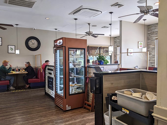Inside, ceiling fans lazily spin above comfortable booths where conversations flow as freely as the coffee. This isn't designer décor; it's the authentic stage for Delaware's comfort food theater.