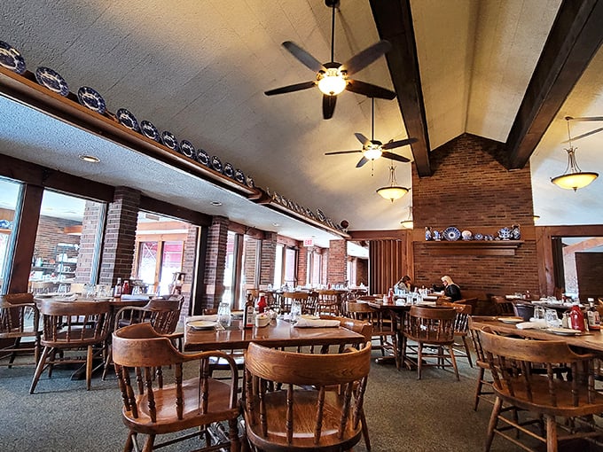 Wooden chairs, exposed brick, and vaulted ceilings create the perfect backdrop for serious eating. Comfort meets craftsmanship in this timeless dining room.