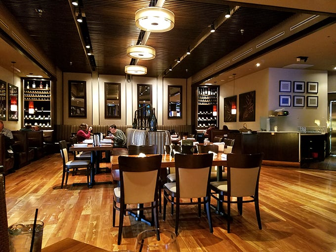 Inside, warm wood floors and thoughtful lighting create the perfect backdrop for memorable meals and conversations.