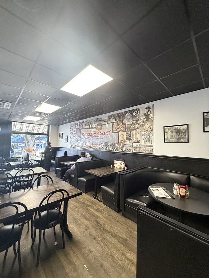 Black vinyl booths and a wall of local history create the perfect backdrop for breakfast conversations that have spanned generations.