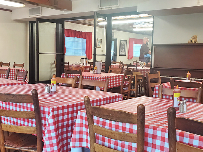 Red and white checkered tablecloths – the universal signal that you're about to experience comfort food that doesn't need Instagram filters to impress.
