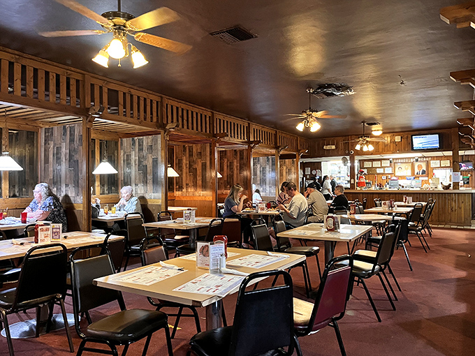 Step inside and the wood-paneled warmth embraces you like your favorite aunt's living room—if your aunt happened to be a fried chicken savant.