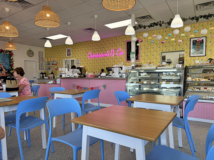 Cheerful chaos of yellow walls and blue chairs – this isn't just a bakery, it's a mood elevator with pastries as the prescription.