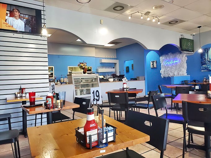 Blue walls and simple wooden tables create a no-frills atmosphere where the food—not the decor—takes center stage.