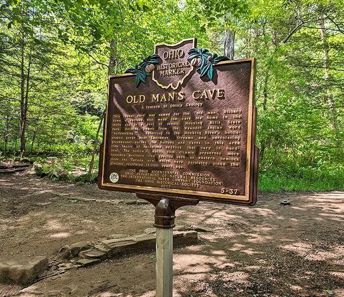 History carved in bronze: Old Man's Cave marker stands as a reminder that even hermits knew a good real estate opportunity when they saw one.