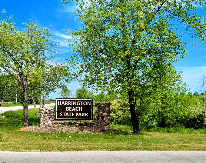 The entrance sign stands like a humble gatekeeper to paradise. No flashing neon needed when what lies beyond speaks for itself.