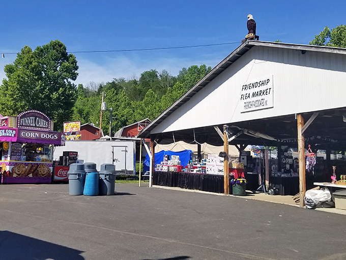 The market's entrance stands proudly under Indiana skies, complete with a watchful eagle perched atop. Classic fair food signs promise delicious fuel for your treasure hunting expedition.