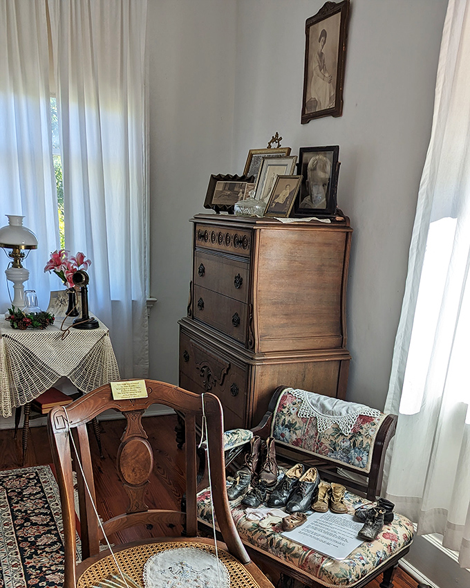 Antique furniture arranged with meticulous care tells stories of bygone eras. That chair might look inviting, but locals swear some invisible occupant still claims it.