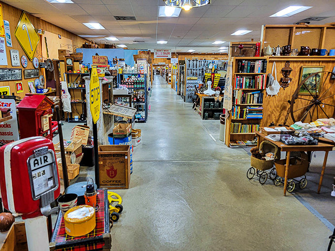 Endless aisles of possibility unfold before you, where vintage gas pumps stand sentinel at the entrance to a wonderland of collectibles and curiosities.
