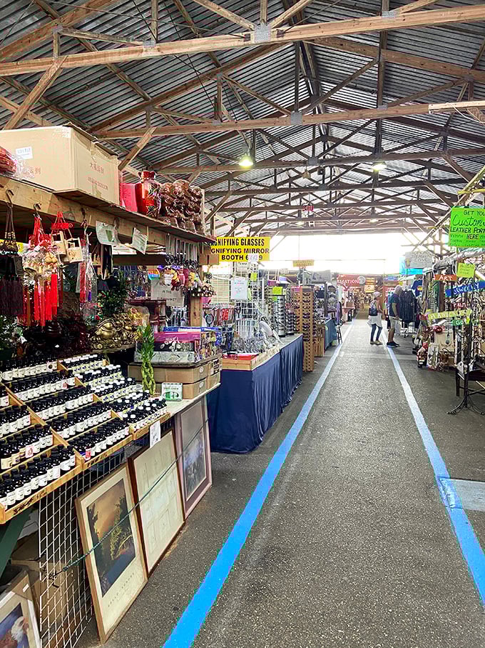 Long, covered walkways stretch into retail infinity. The blue lines aren't just decoration—they're breadcrumbs to help you find your way back to reality.