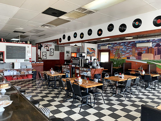 Classic black and white checkered floors meet vinyl records on the wall. Fitzy's interior feels like stepping into a time machine where breakfast never went fancy.