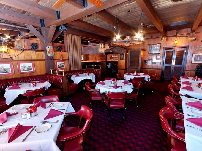 Wood-paneled walls, exposed beams, and red leather booths—this isn't just dining, it's time travel to when restaurants understood the art of atmosphere.