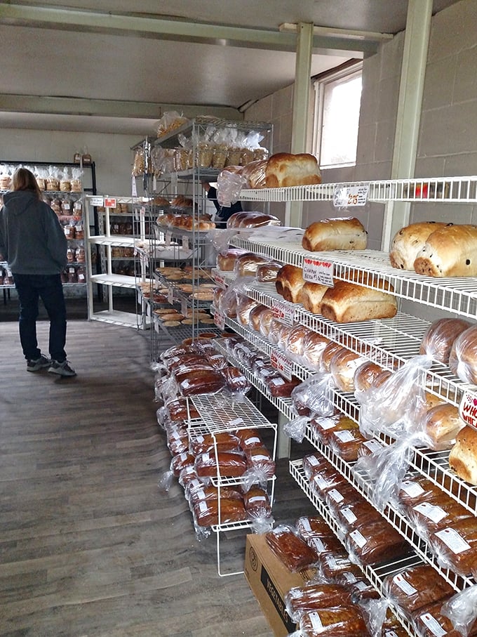 Treasure hunters, take note! These simple shelves hold edible gold—loaves of fresh-baked bread and pastries that make grocery store versions seem like distant, sad relatives.
