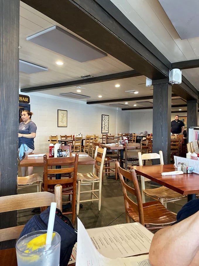 Simple wooden tables and chairs tell you everything you need to know—this place prioritizes what's on your plate, not what's holding it up.