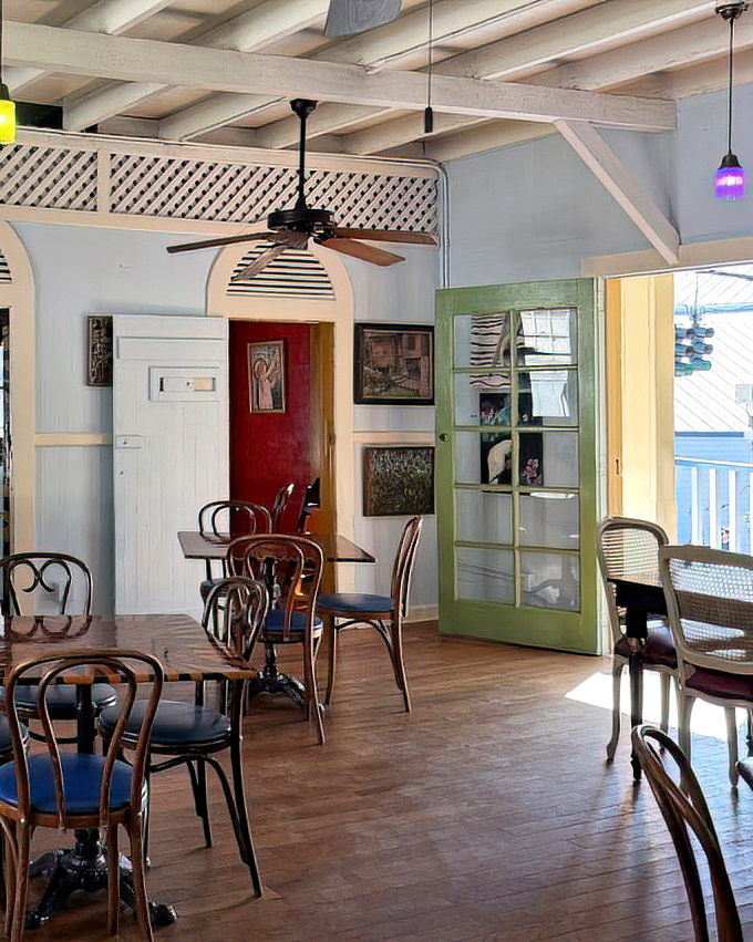 Inside, pastel-colored walls and mismatched furniture create the perfect backdrop for culinary magic—like your eccentric aunt's beach house, but with better food.