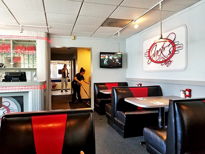 Red and black booths that have cradled countless conversations and comfort food cravings—where every seat feels like the best one in the house.