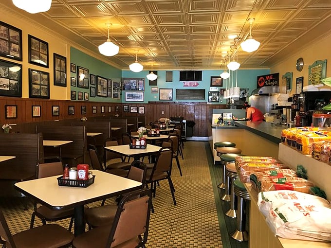 Step inside and time stands still – mint green walls, vintage photographs, and those iconic tin ceiling tiles create the perfect backdrop for comfort food conversations.