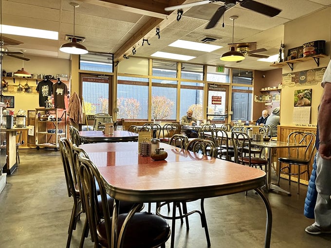 Classic diner ambiance with wooden tables and ceiling fans—where conversations flow as freely as the coffee refills.