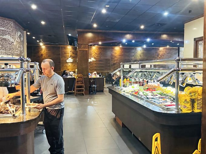 Inside, the warm lighting and modern buffet stations create an atmosphere that's several notches above what you'd expect from a place where elastic waistbands are practically mandatory.