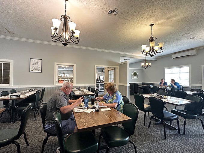 Chandeliers cast a warm glow over wooden tables where conversations flow as freely as the coffee. No designer lighting needed when the food shines this bright.