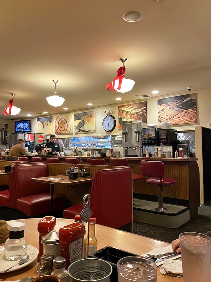 Classic red vinyl booths and counter seating—where strangers become temporary breakfast companions and the coffee never stops flowing.