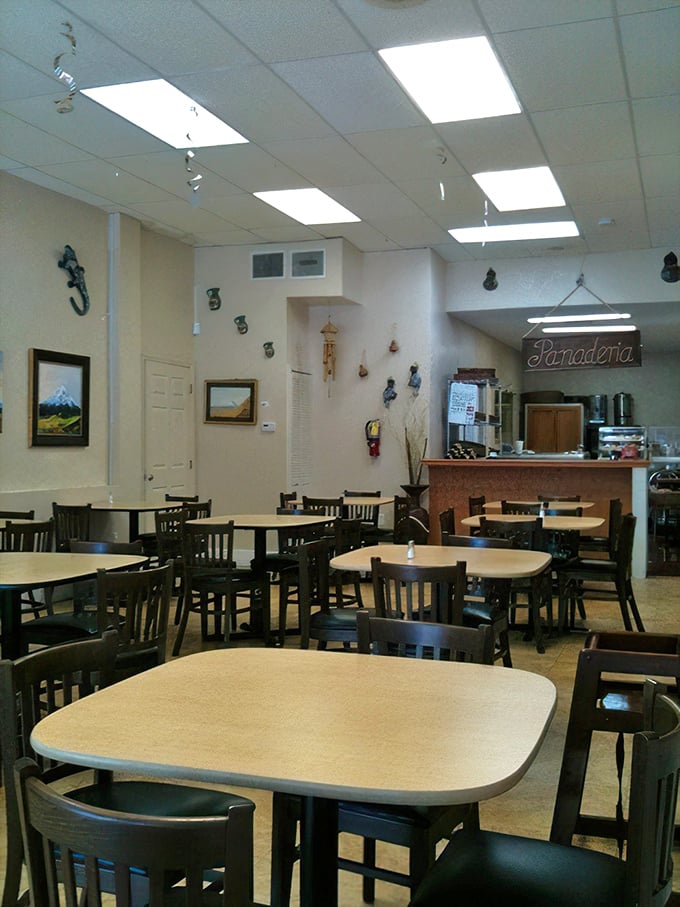 Simple tables, modest decor, and that "Panaderia" sign promising fresh-baked treasures—this is where memories are made, one meal at a time.