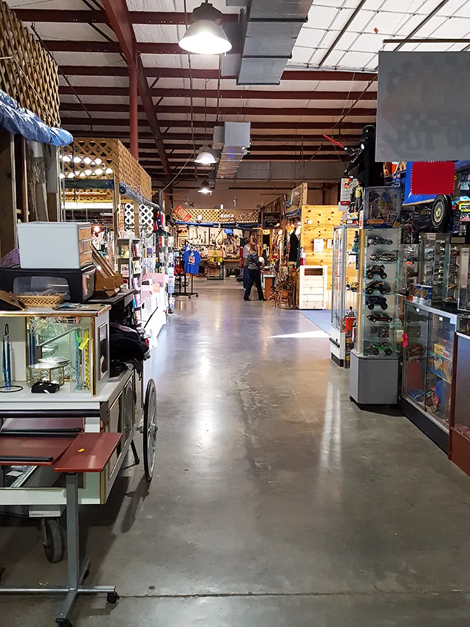Vintage display cases and wooden booths create a maze of discovery, where yesterday's treasures become tomorrow's conversation pieces. 