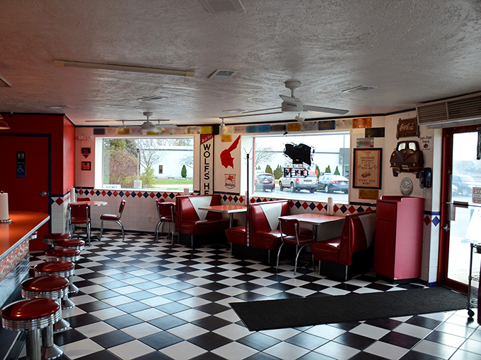 Step inside and suddenly it's 1955 again. The checkerboard floor and cherry-red booths aren't trying to be retro—they're authentic artifacts from when "viral" meant the flu.