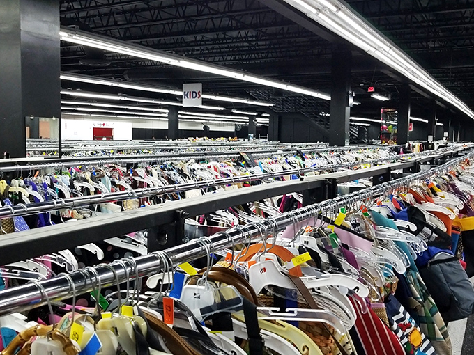 Clothing racks stretch to infinity and beyond, a textile galaxy where yesterday's fashion finds tomorrow's admirers.