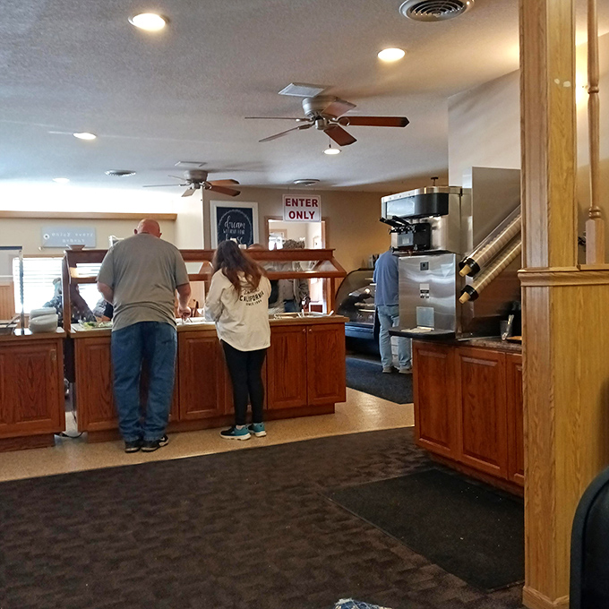 Inside Jo's, where ceiling fans whirl above the breakfast buffet line—democracy in dining where everyone serves themselves equal portions of morning happiness.