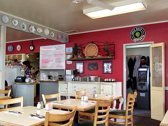 Red walls adorned with decorative plates create the perfect backdrop for breakfast magic. This isn't décor—it's a warm hug in restaurant form.