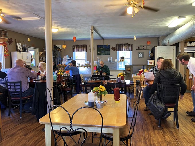 Where locals and travelers break bread together. Notice the fresh flowers on the tables—little touches that chain restaurants forgot matter.