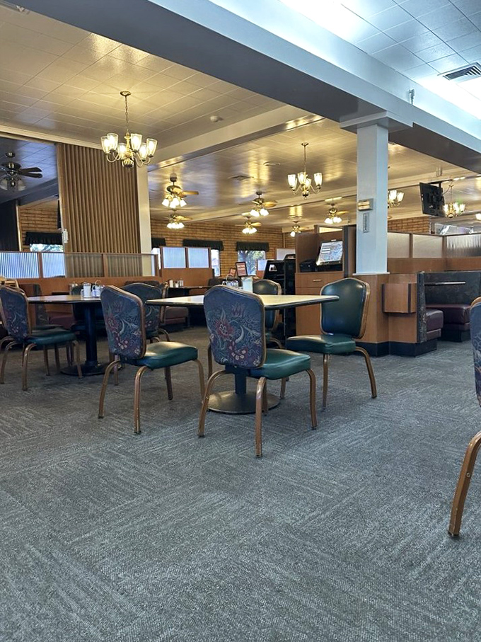 Classic diner ambiance with comfortable booths and those distinctive green chairs—where strangers become neighbors over coffee refills.